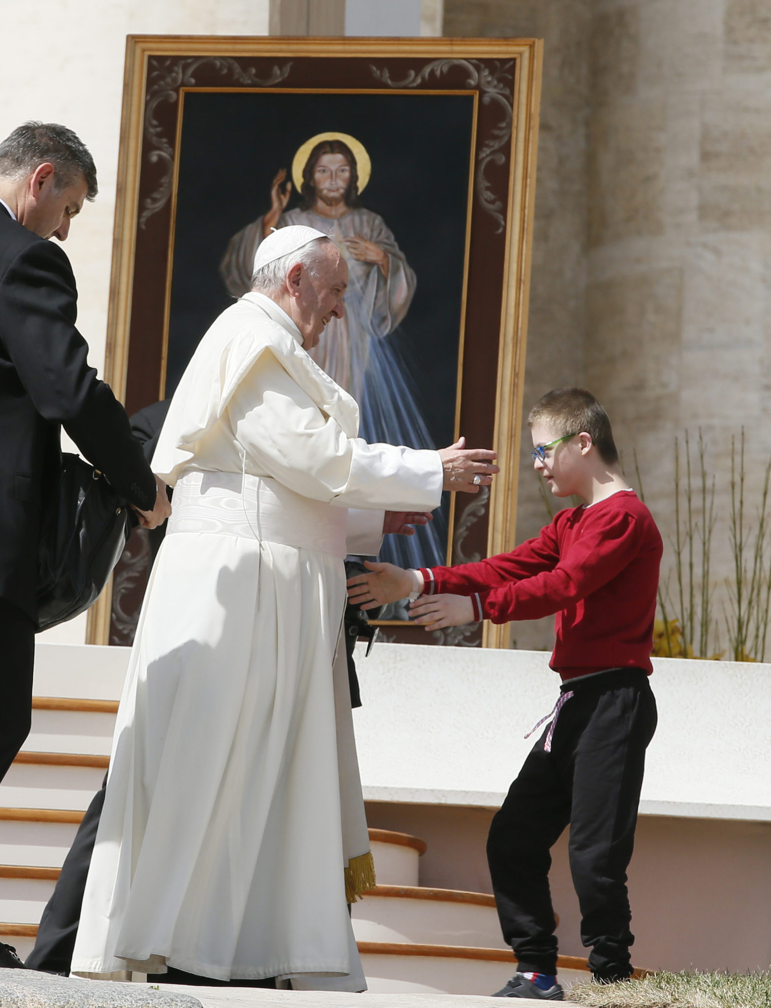 Pope Francis greets a boy after celebrating Mass marking the feast of ...