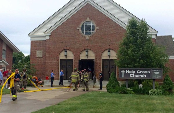 Springfield firefighters on the scene of an attic fire at Holy Cross ...