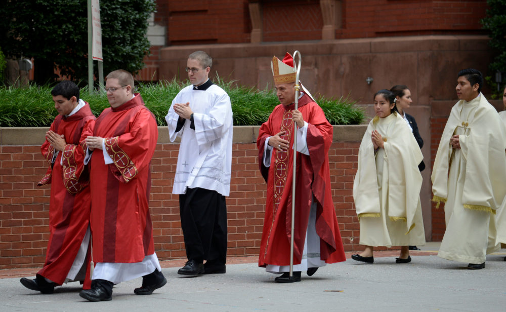 Washington Auxiliary Bishop Mario E. Dorsonville walks with his crosier ...
