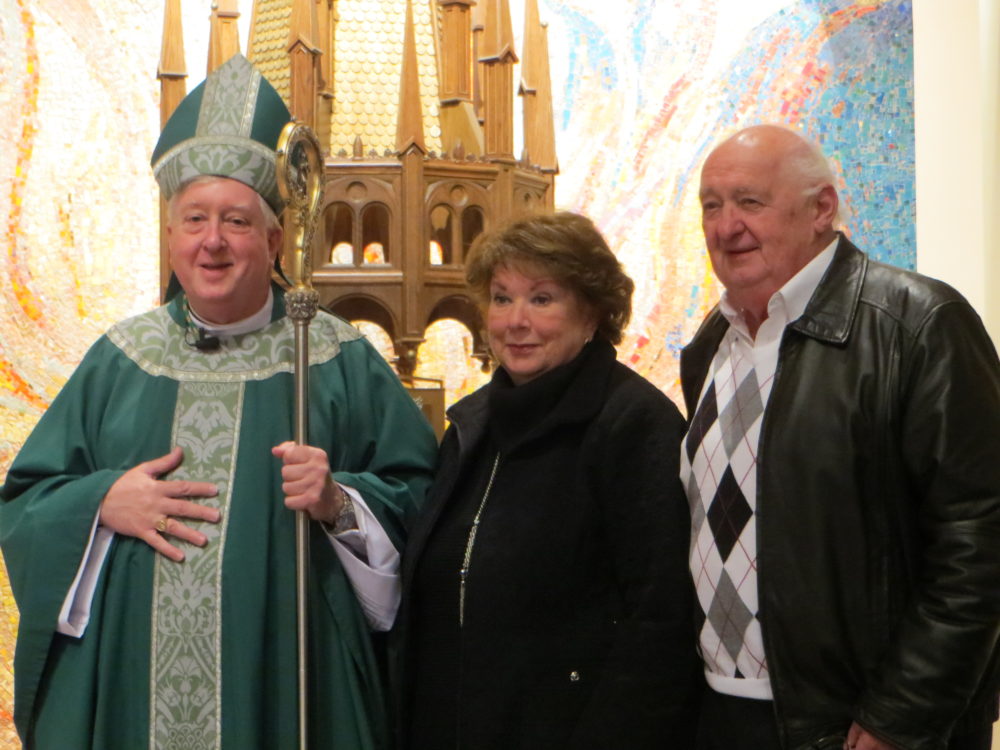 Pictured with Bishop Rozanski are Diana and Harold Ouellette ...