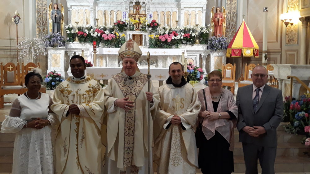 Father Christopher Dudek (third from right) poses with his parents ...