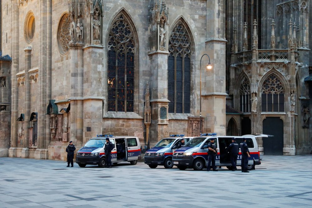 Police officers stand guard outside St. Stephan’s Cathedral in Vienna ...