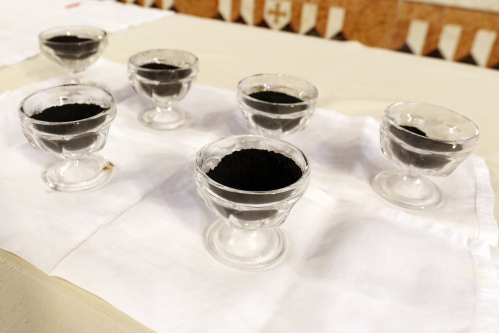 Glass cups containing ashes are seen on an altar between Ash Wednesday ...