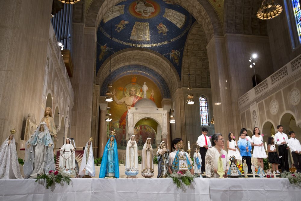 Marian images line a table during the 17th annual National Filipino ...