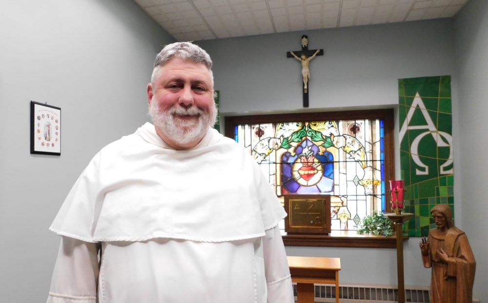 Dominican Father Augustine Judd poses in the chapel at the Bishop ...