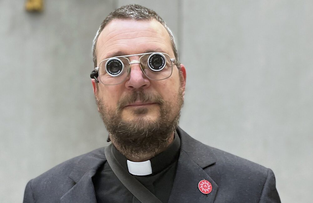 J esuit Father Justin Glyn, who is blind, is pictured at a news ...