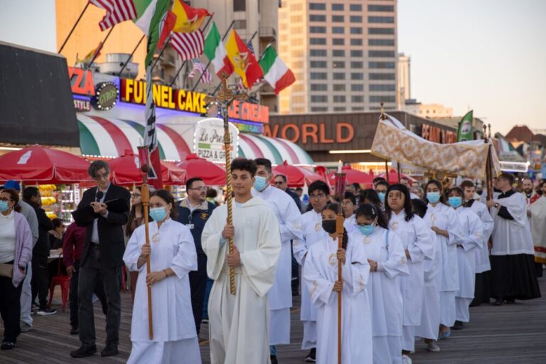 People in Atlantic City, N.J., take part in a eucharistic procession ...