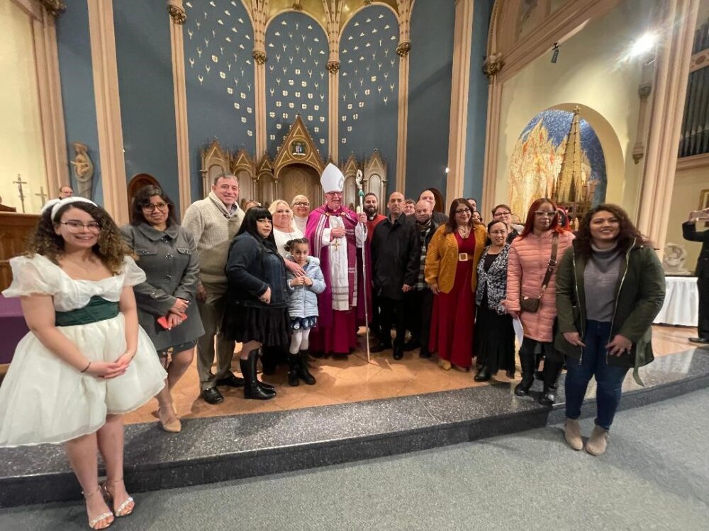 Bishop William D. Byrne poses with members of Our Lady of the Sacred ...