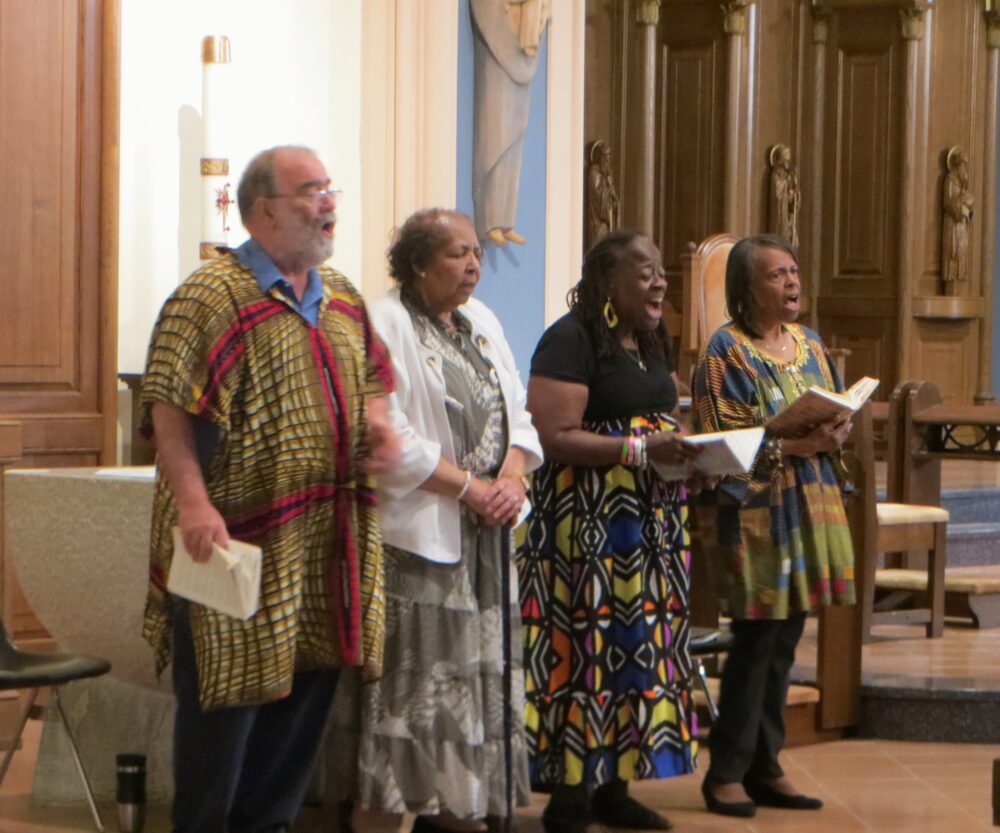 Brian Skelly (left) sings with the Gospel Choir at St. Michael’s ...