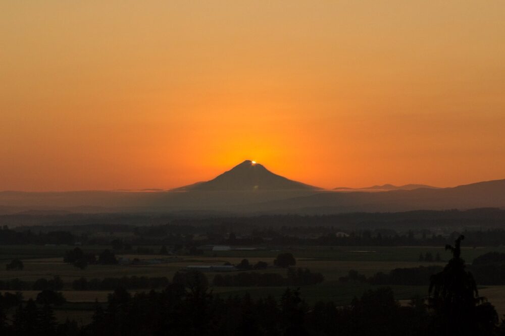 Sunrise behind Mount Hood, as seen from Mount Angel Abbey on August 6 ...