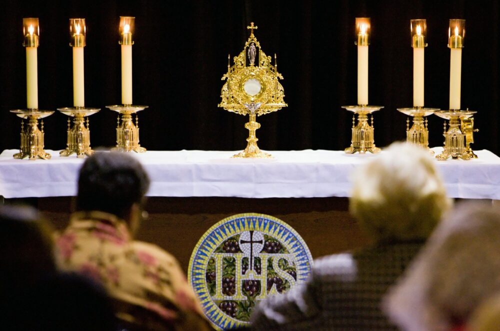 People gather for Eucharistic adoration in this file photo from May ...