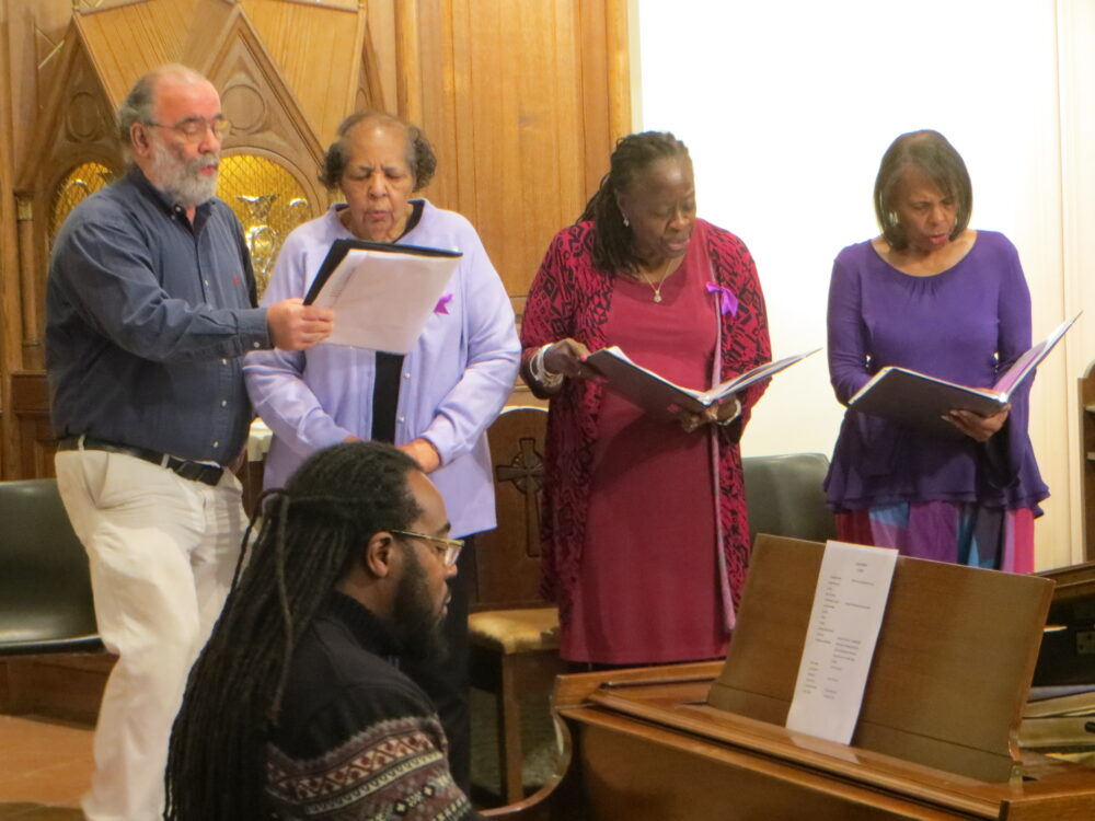 Members of the St. Michael’s Cathedral Gospel Choir sing during the ...