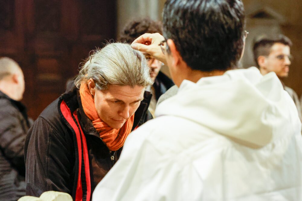 A woman receives ashes during Pope Francis’ Ash Wednesday Mass at the ...