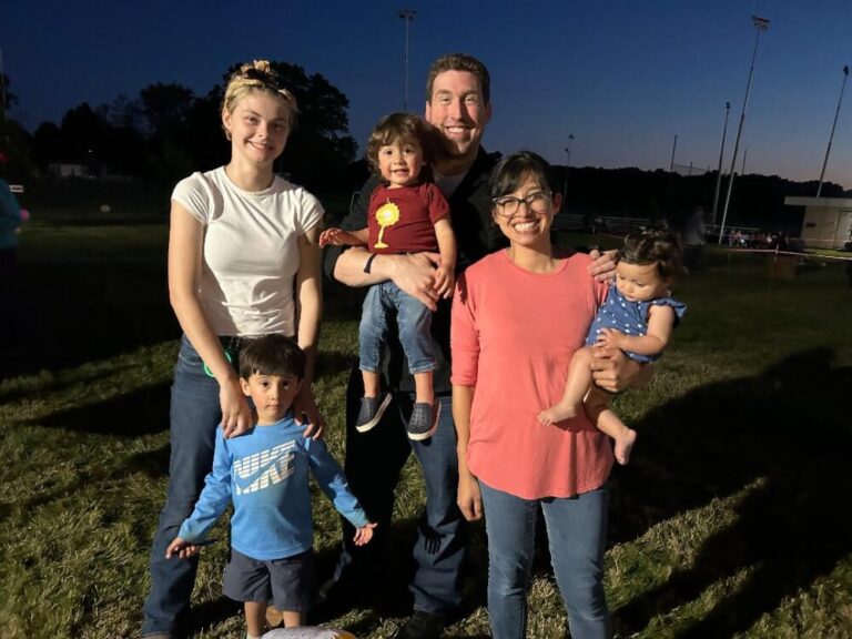 Teen volunteer Alissa Aldrich (left) poses for a picture with the Marinak family at Faith on ...