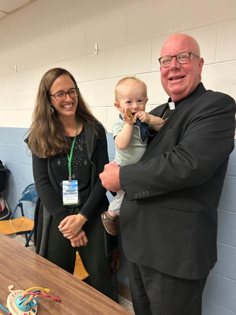 Bishop William D. Byrne poses with Kristin and John Bosco Todzia ...